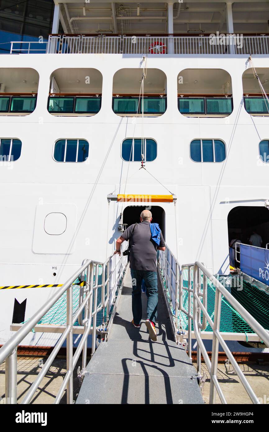 Male passenger Boarding gangplank walkway onto P&O cruise ship, MS Iona ...