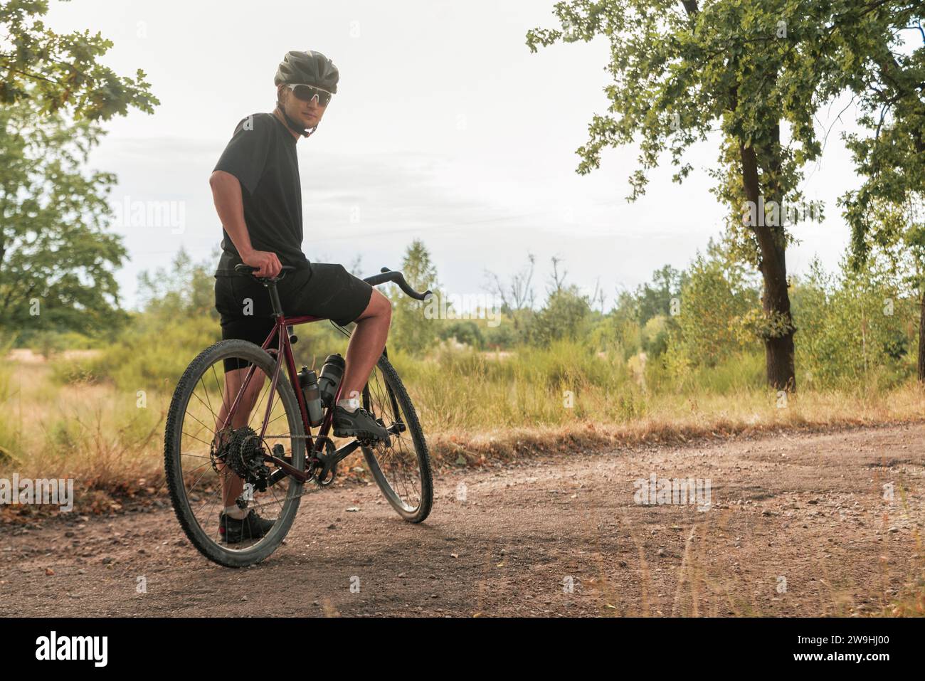 Person stands on gravel road hi-res stock photography and images - Alamy