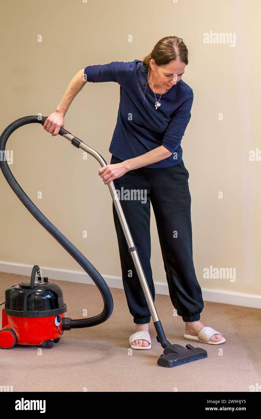 Vacuuming woman hi-res stock photography and images - Alamy