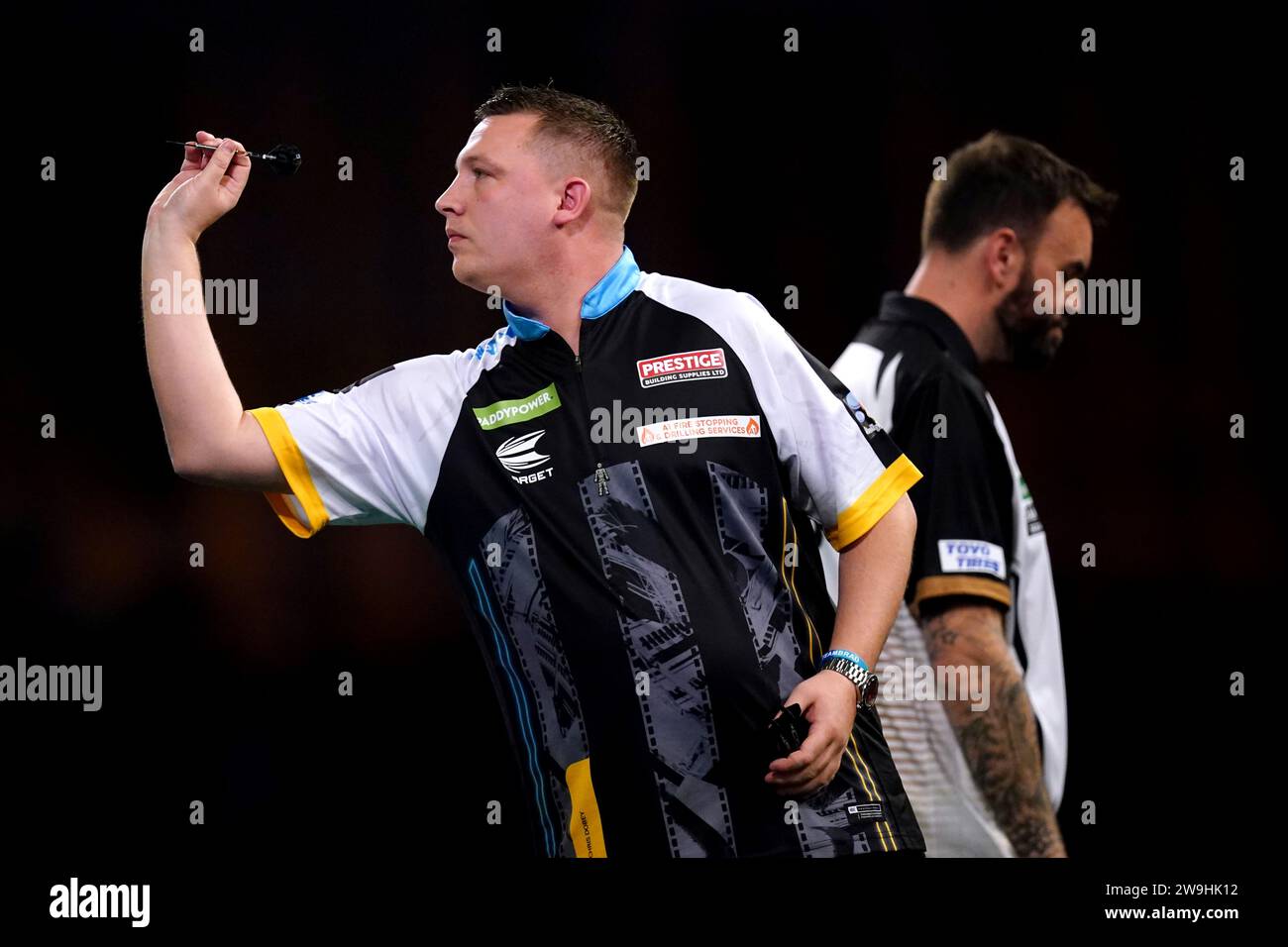 Chris Dobey during his match against Ross Smith (right) on day eleven ...