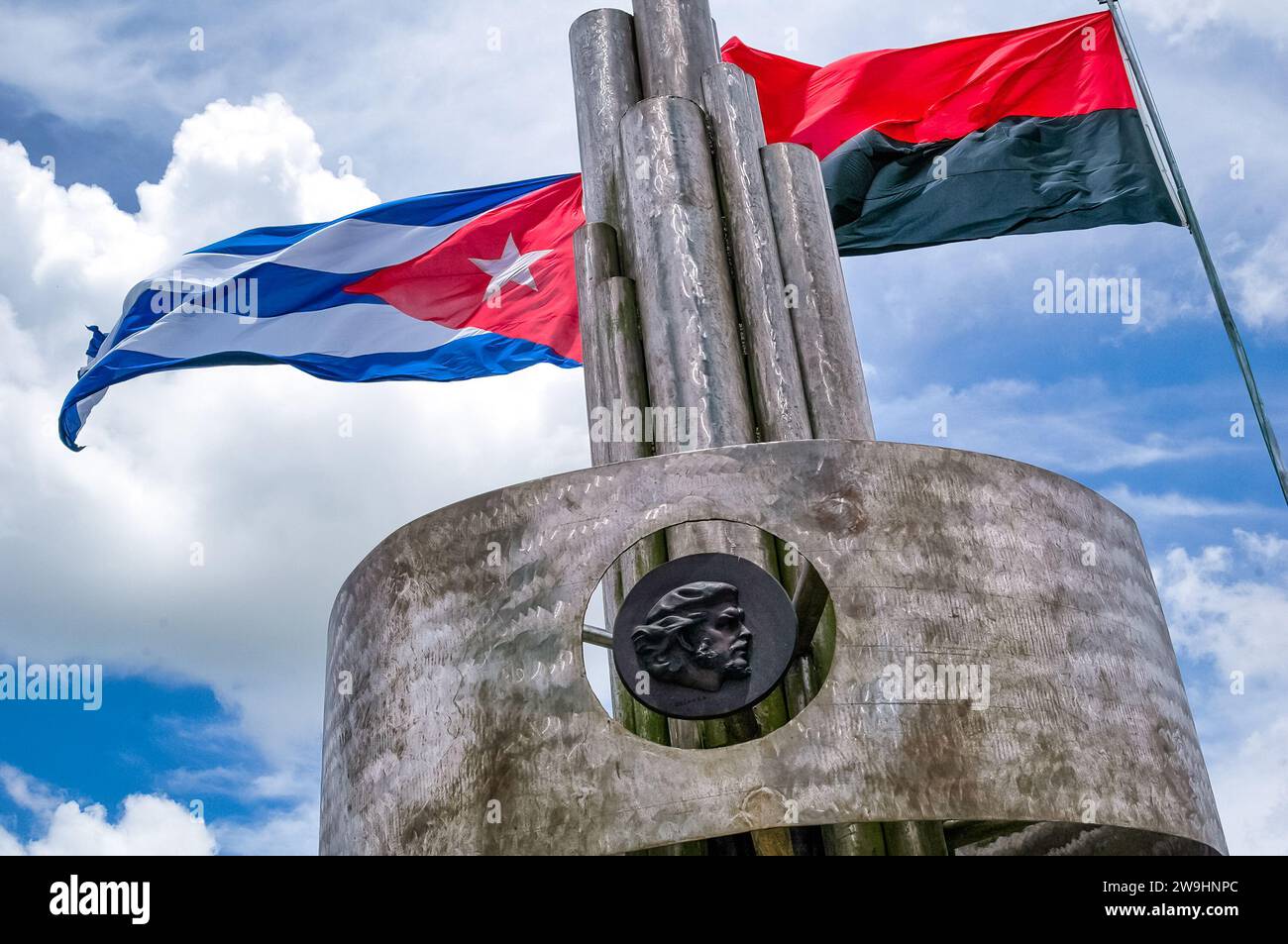 Cuban Flags waving in blue sky at the Che Guevara memorial in Loma del ...