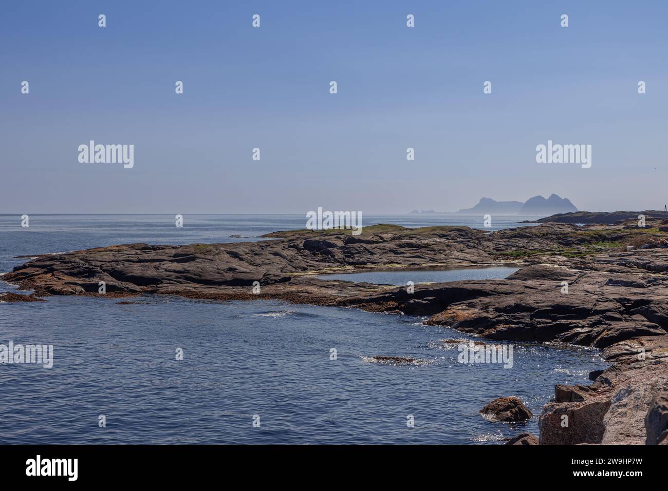View of the flat, rocky shores of the Lofoten Islands, washed by the ...