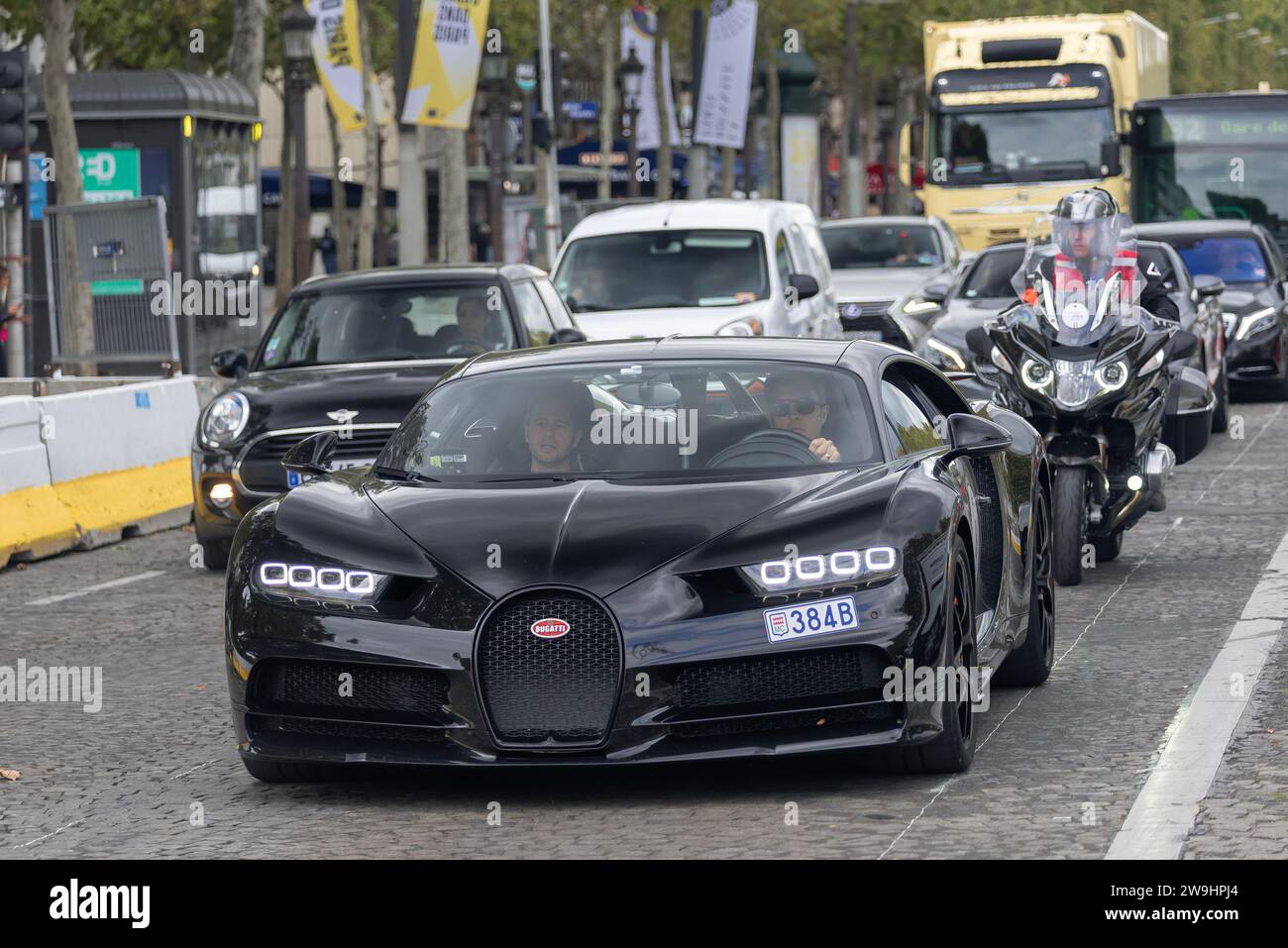 Paris, France - Black Bugatti Chiron Sport driving on the Champs Elysée ...