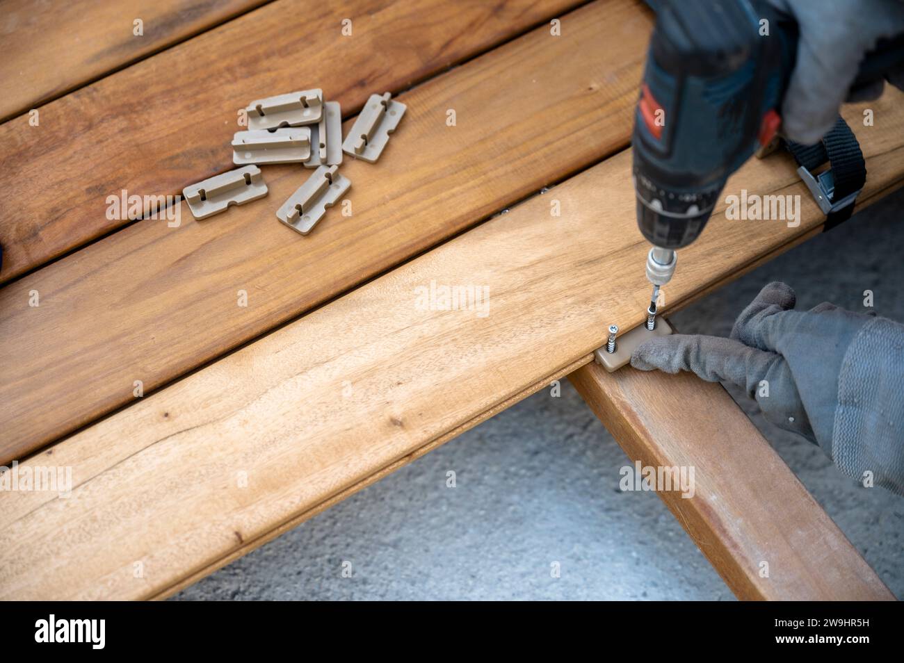 Screwing screw into wooden plank hi-res stock photography and images ...