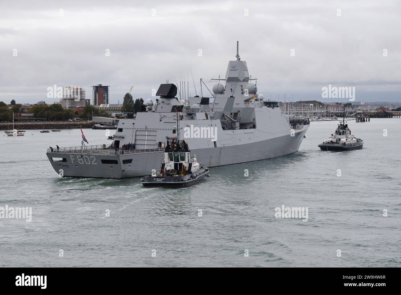 Tugs escort the Dutch air defence frigate HNLMS DE ZEVEN PROVINCIEN ...