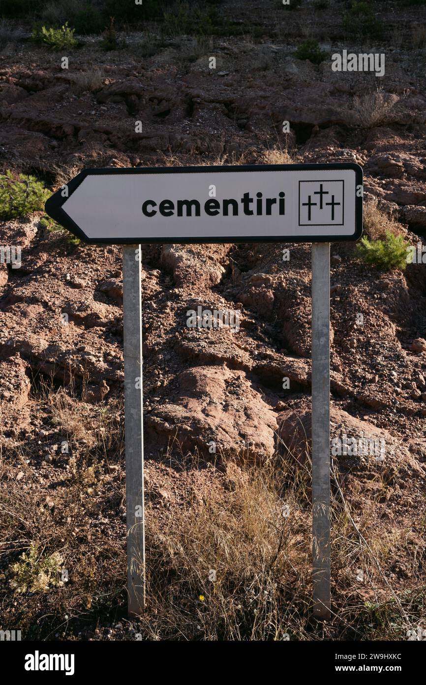 Road sign with crosses for a cemetery on a deserted road at the city's ...