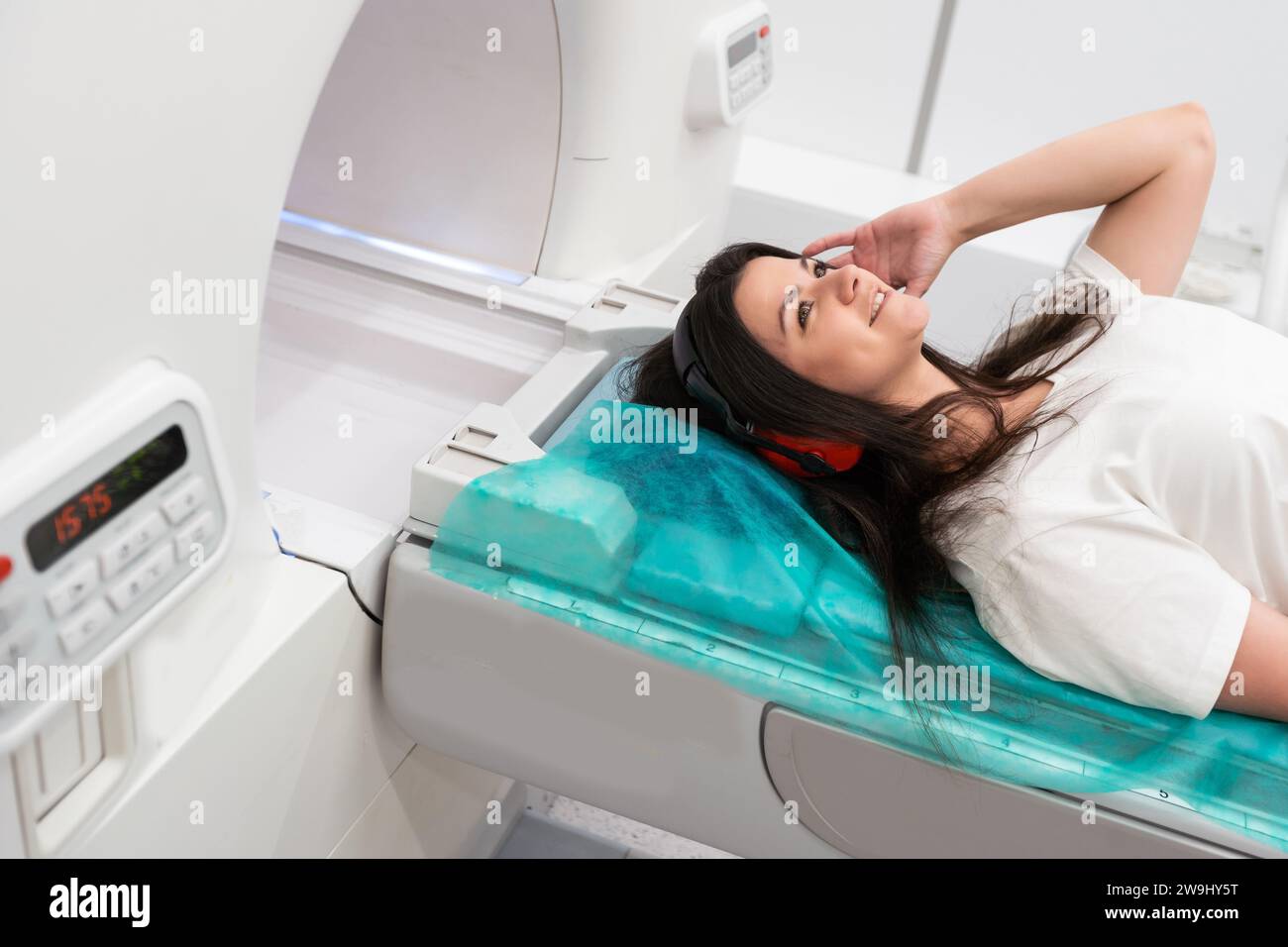 Female patient undergoing MRI - Magnetic resonance imaging in Hospital ...