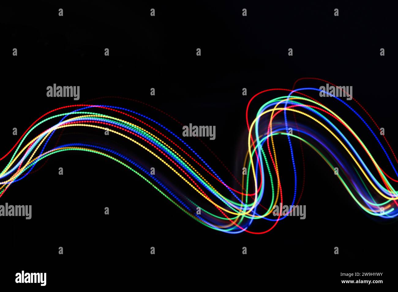 A photograph of vibrant multi-color lights in a long exposure photo ...