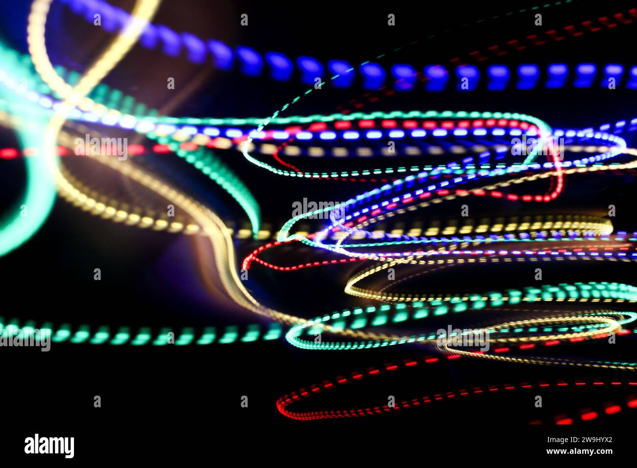 A photograph of vibrant multi-color lights in a long exposure photo ...