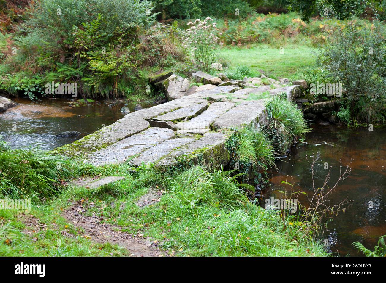 The old stone bridge crossing the river Ellez at the chaos of Mardoul ...
