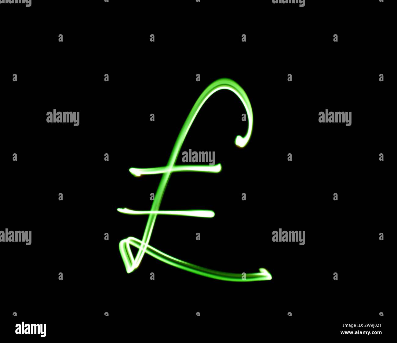 A photograph of a British pound symbol in vibrant green light in a long ...