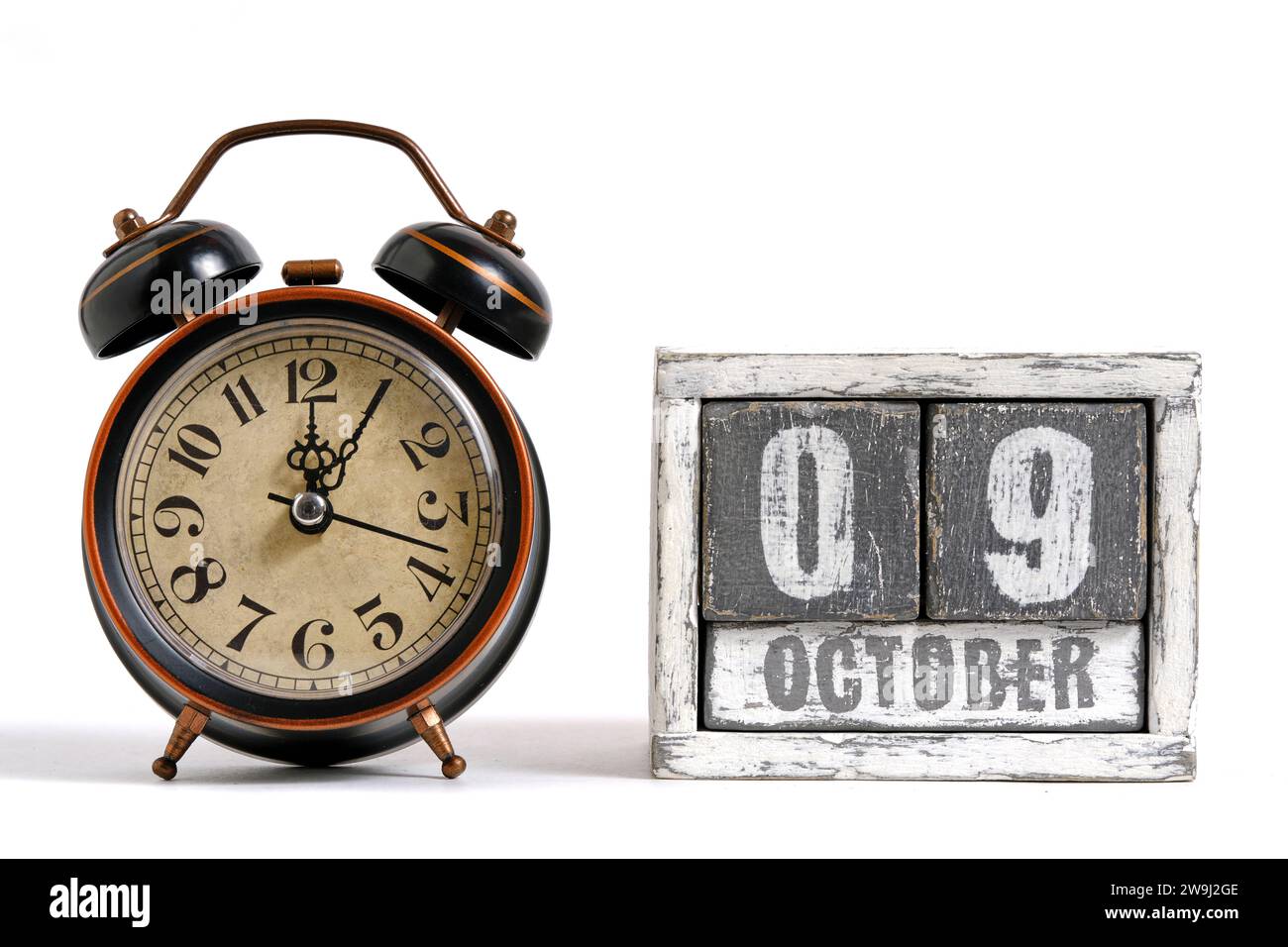 October 09 on wooden calendar with alarm clock white background Stock ...