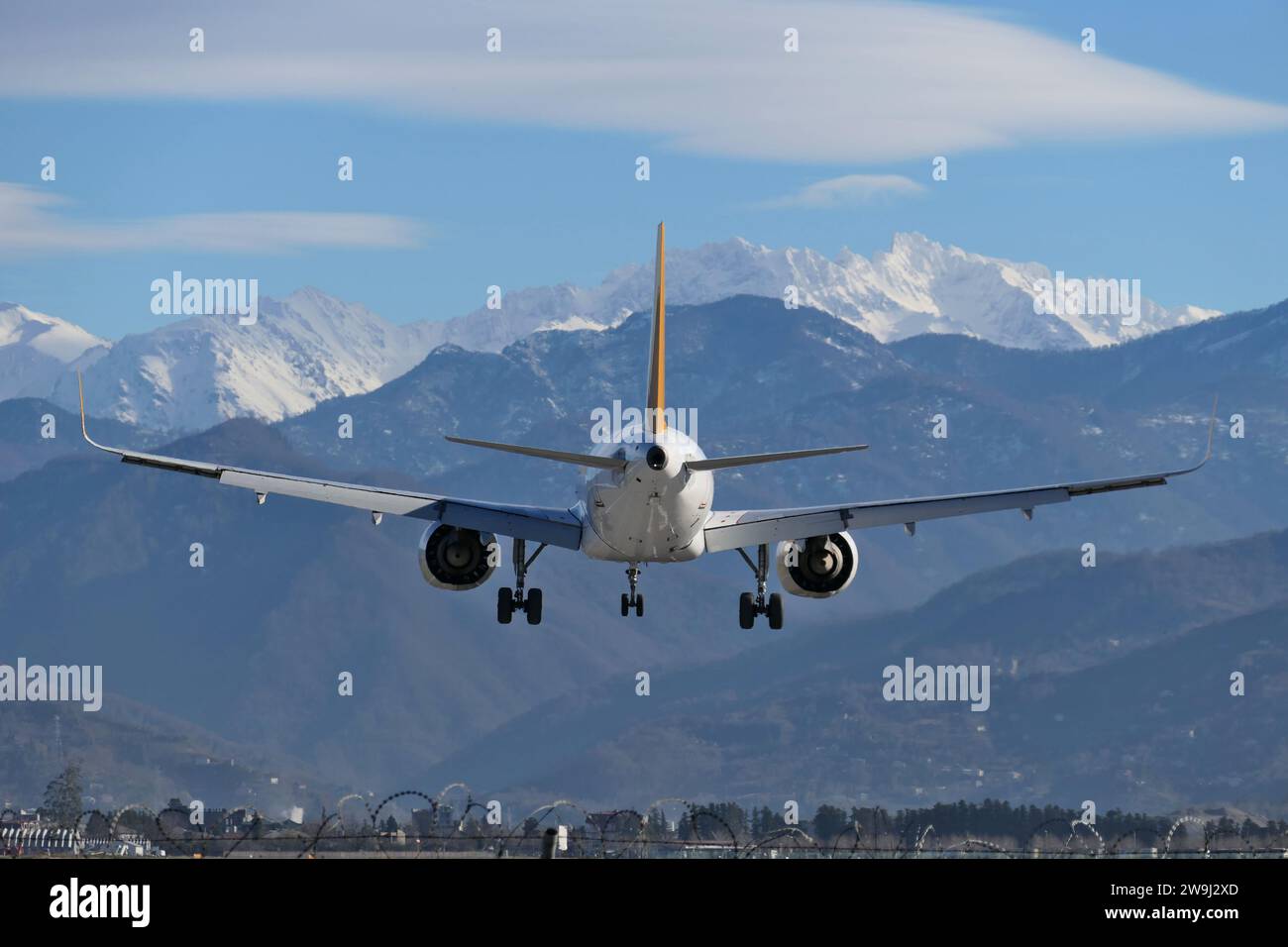 Airplane landing in mountains batumi hi-res stock photography and images - Alamy