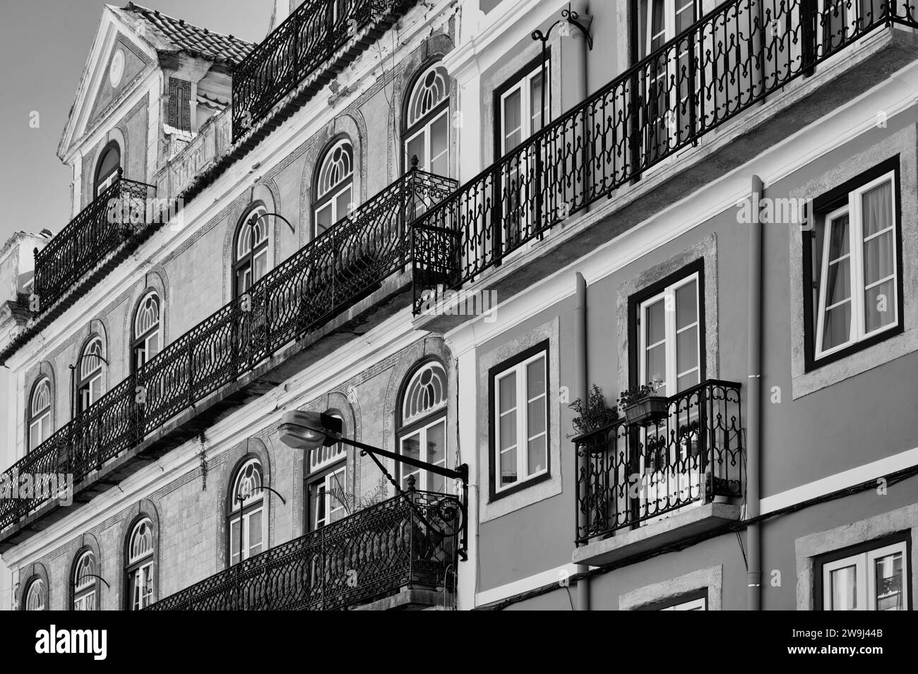 Classic Portuguese architecture with wrought iron balconies and ...