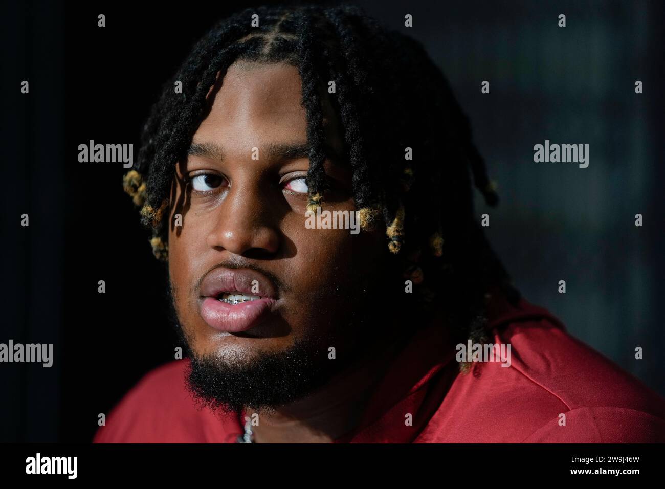 Alabama offensive lineman JC Latham speaks to reporters during a press ...