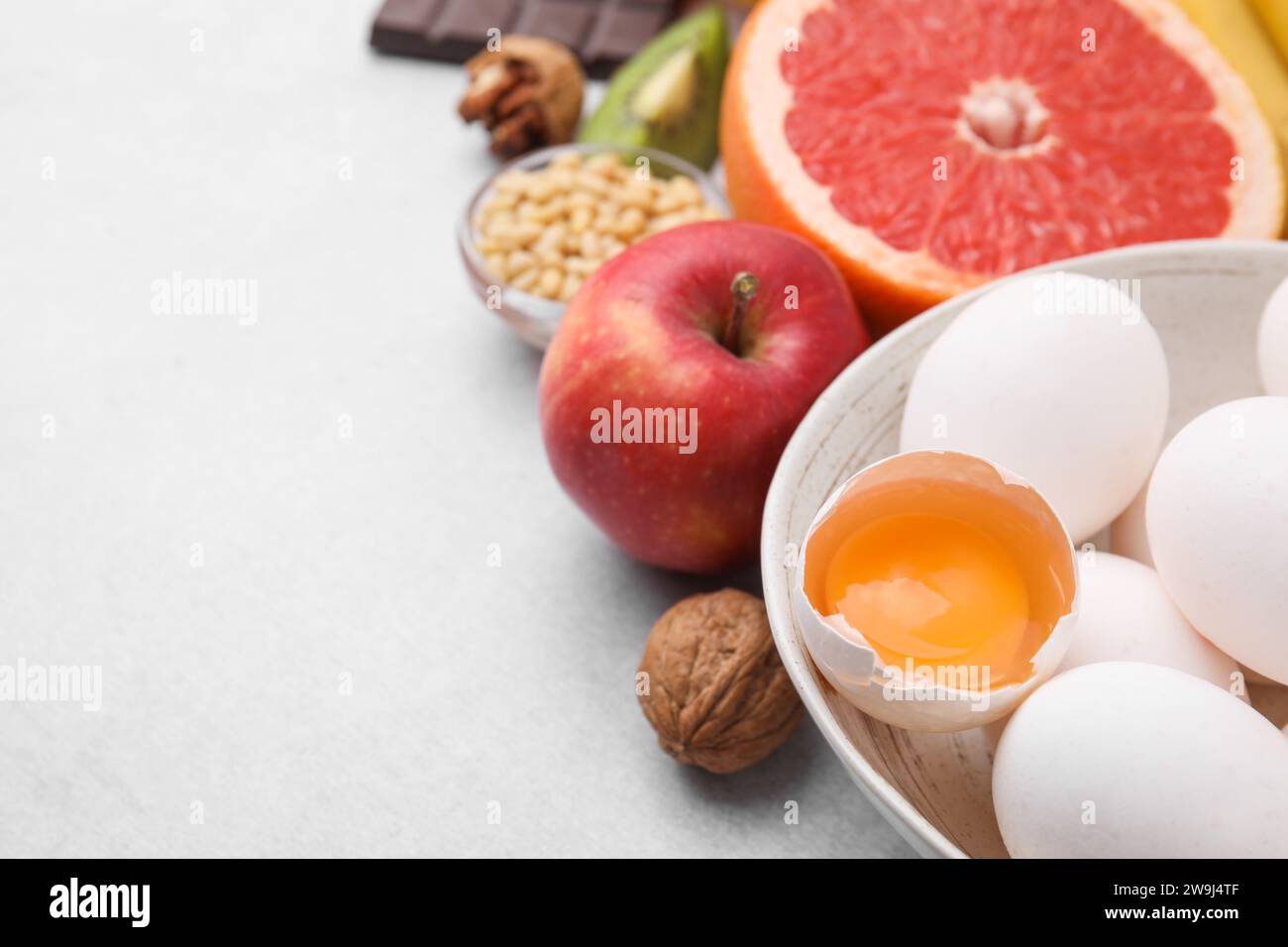 Natural sources of serotonin. Many different products on light table ...