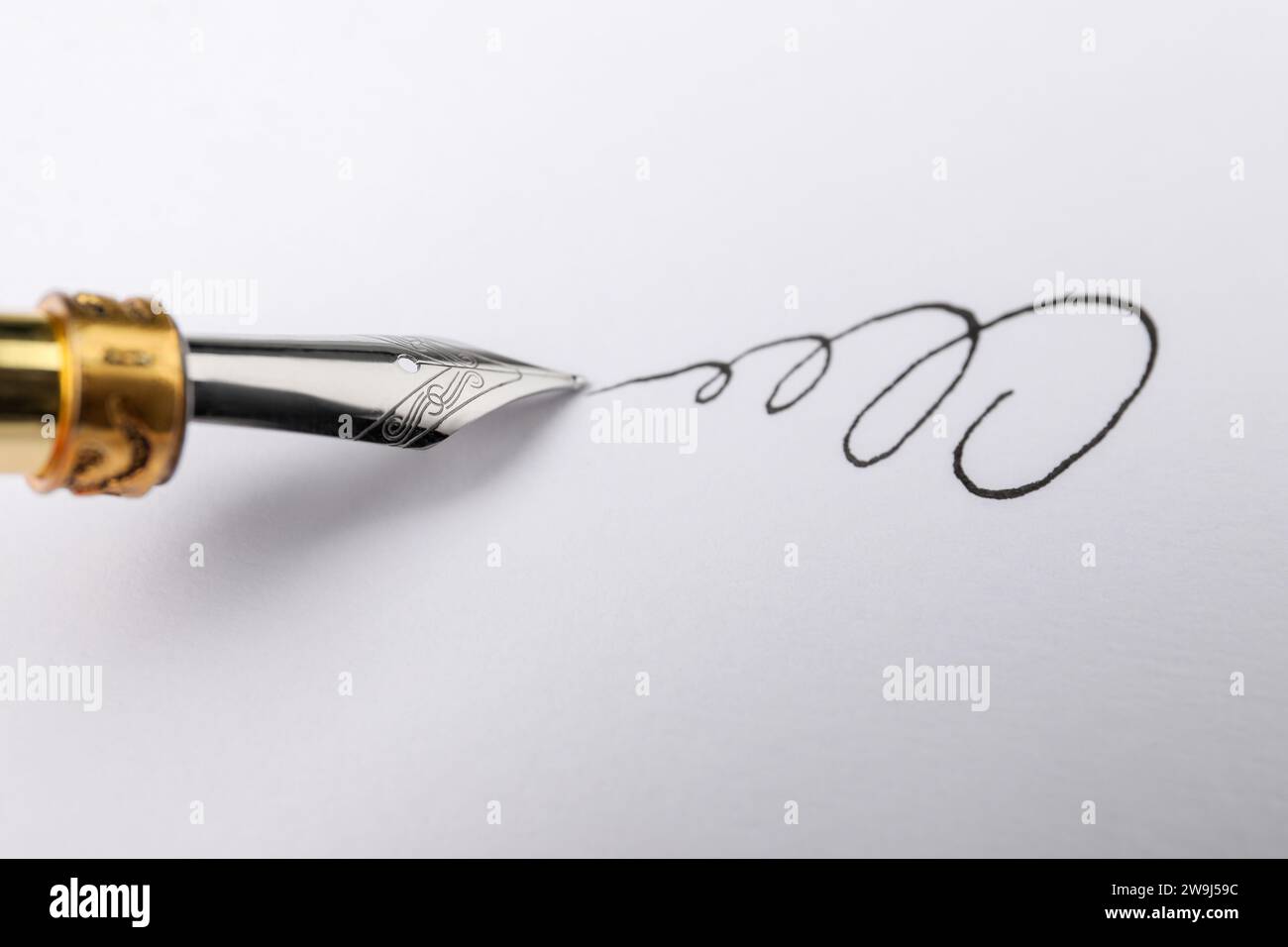 Signing on sheet of paper with fountain pen, closeup Stock Photo - Alamy