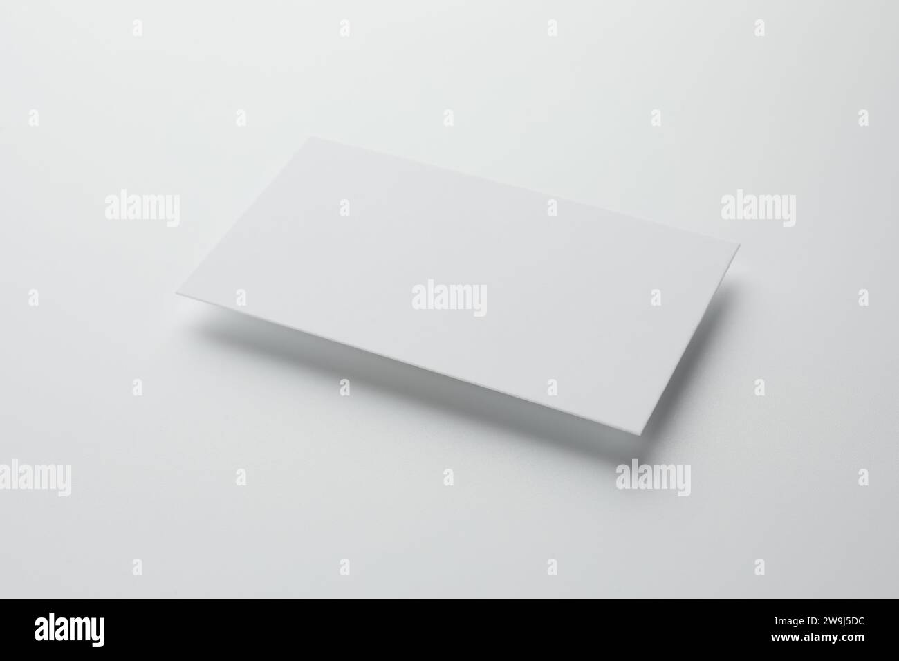 Blank business card on white background. Mockup for design Stock Photo ...
