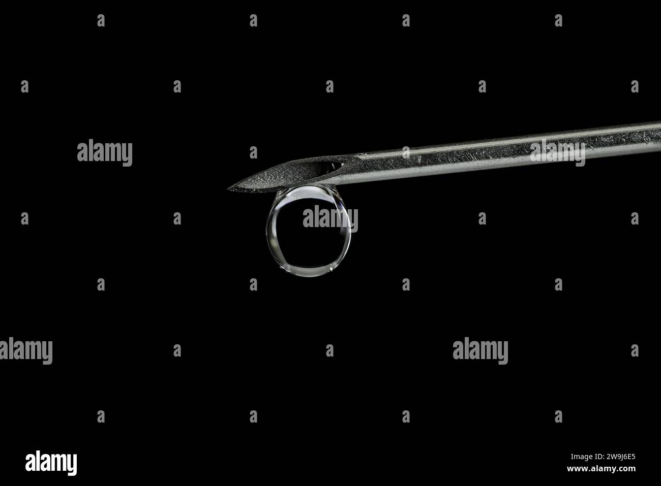 Syringe needle tip and water droplet Stock Photo - Alamy