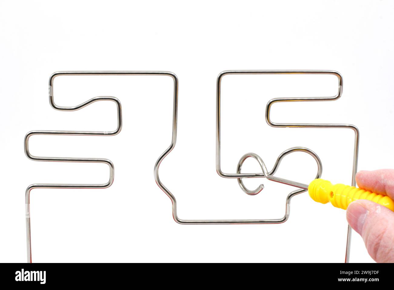 Small wand being moved around a wire frame game without touching the ...