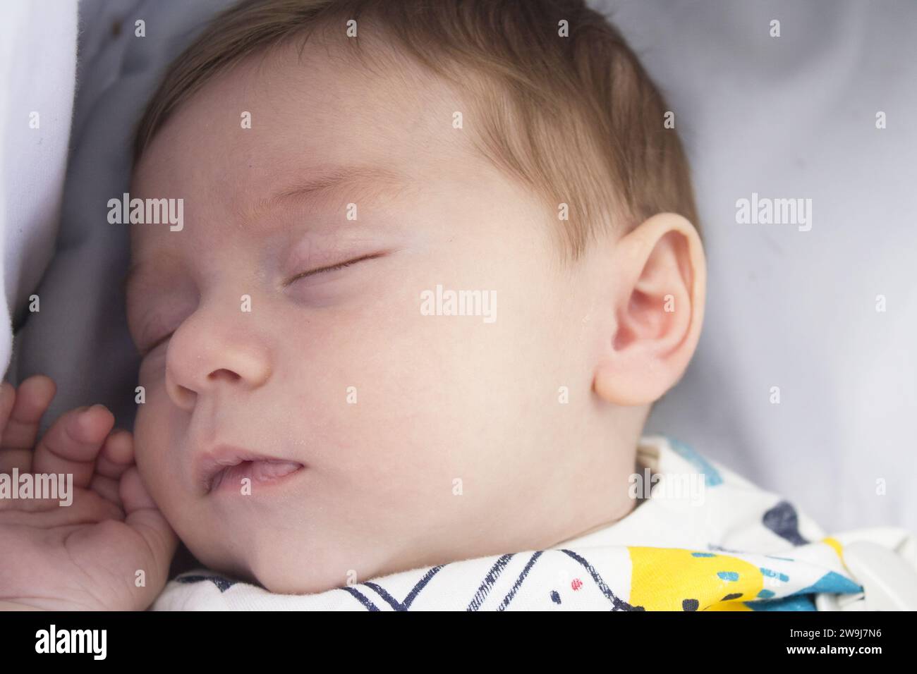 Sleeping two month old baby. Close his eyes Stock Photo - Alamy