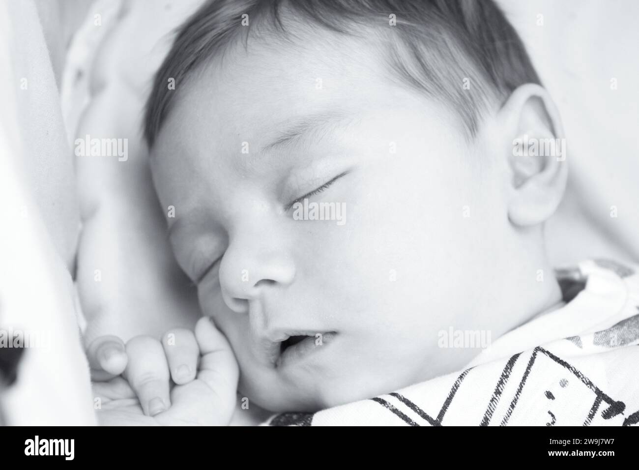 Sleeping two month old baby. Close his eyes Stock Photo - Alamy