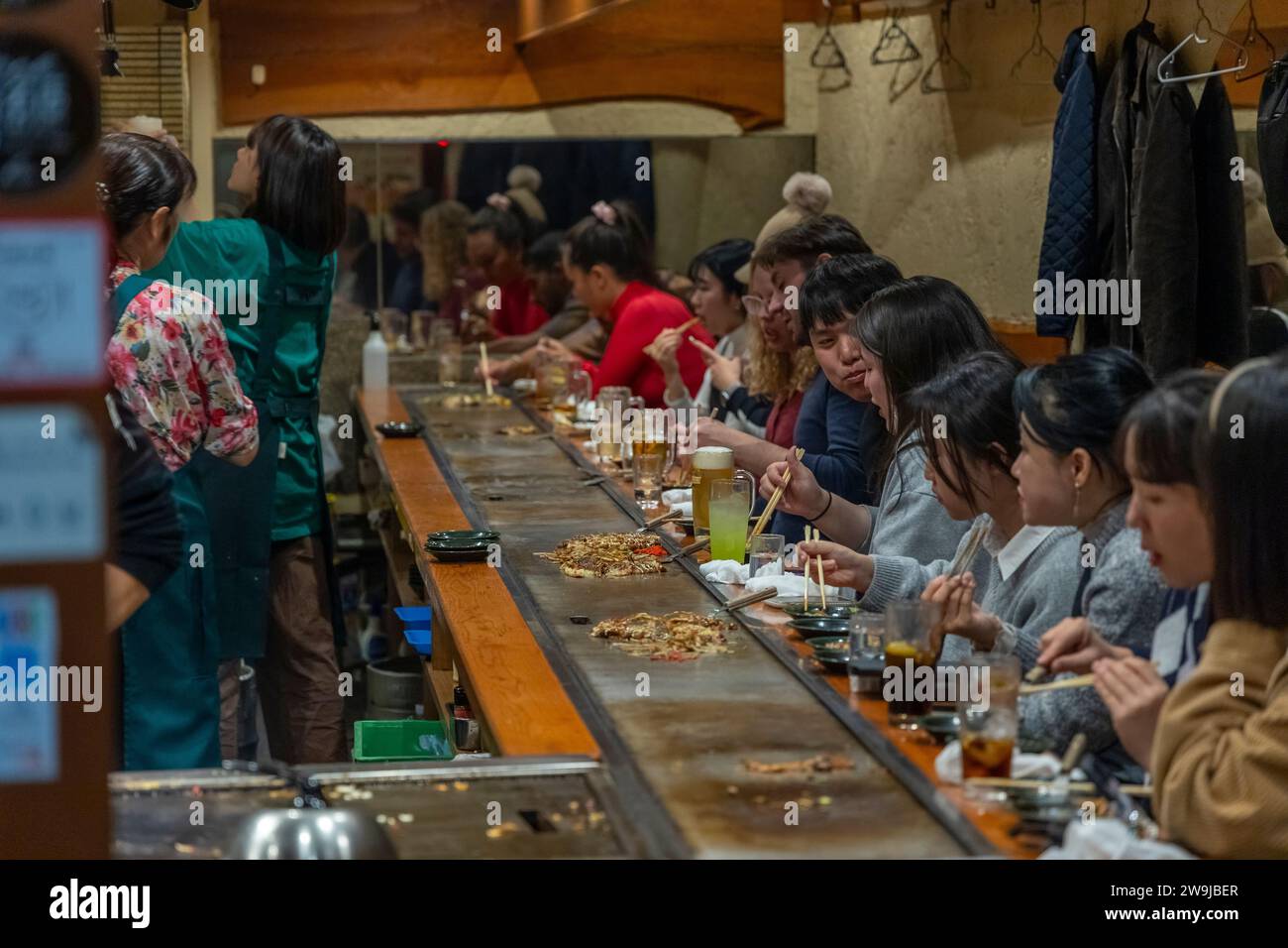 Okonomiyaki , Grilled Pancake, Dotonbouri, Osaka, Japan Stock Photo - Alamy