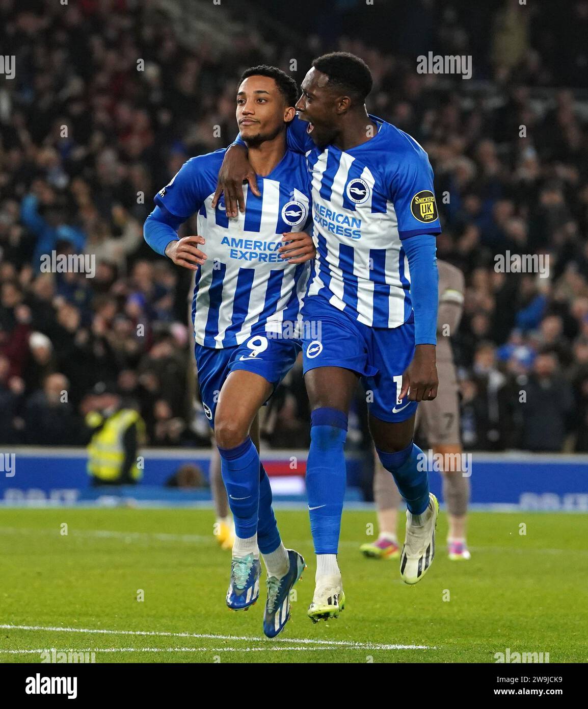 Brighton and Hove Albion's Joao Pedro (left) celebrates scoring their ...