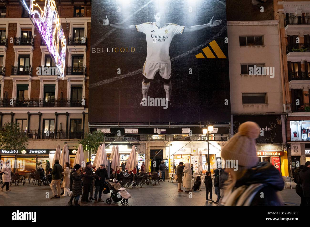 Madrid, Spain. 9th Dec, 2023. Pedestrians walk past a large commercial ...