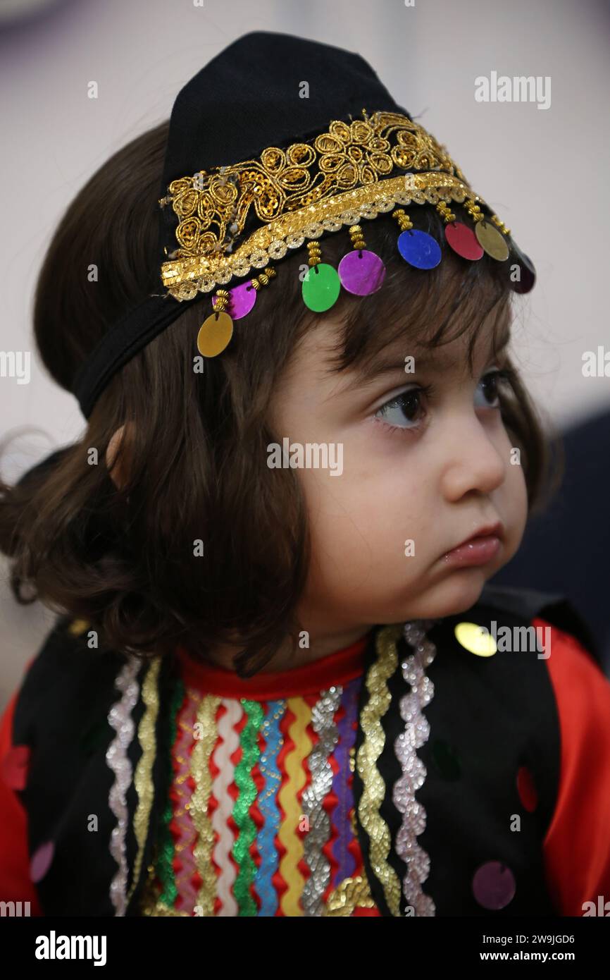 Rasht, Gilan, Iran. 28th Dec, 2023. An Iranian child girl wearing a ...