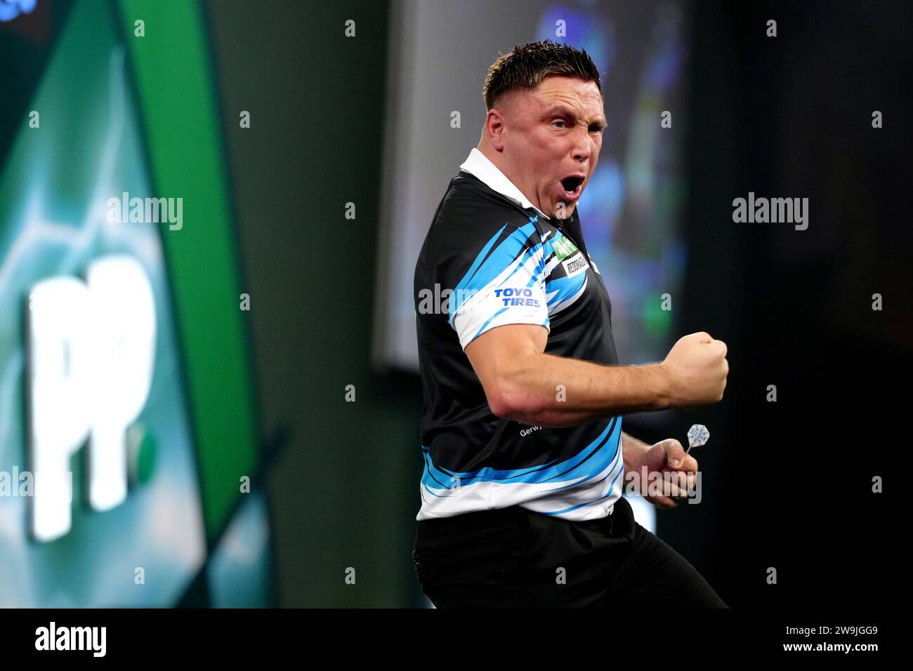 Gerwyn Price reacts during his match against Brendan Dolan on day ...