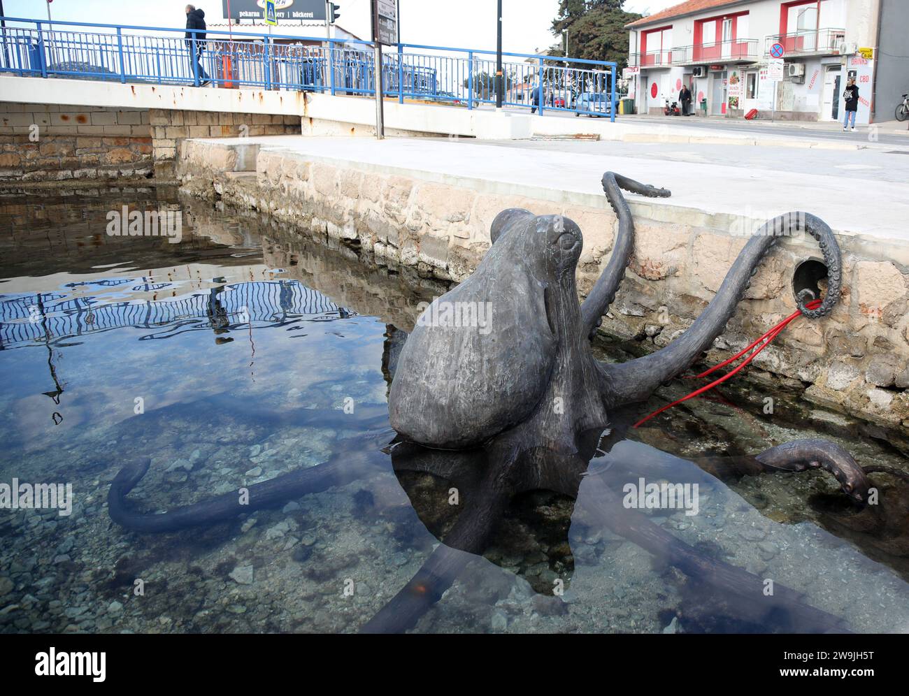 Tisno, Croatia. 28th Dec, 2023. A bronze sculpture of an octopus trying ...