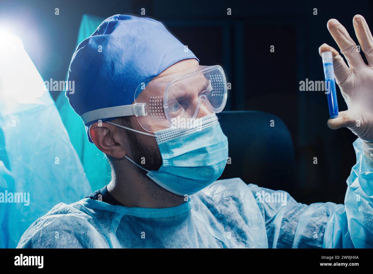 Medical laboratory assistant in personal protective equipment ...