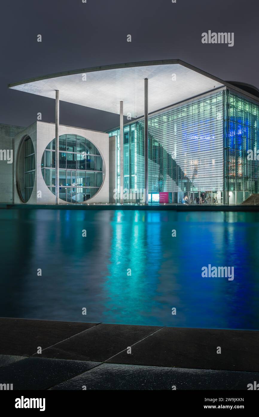 Modern architecture of a government building at night on the waterfront ...