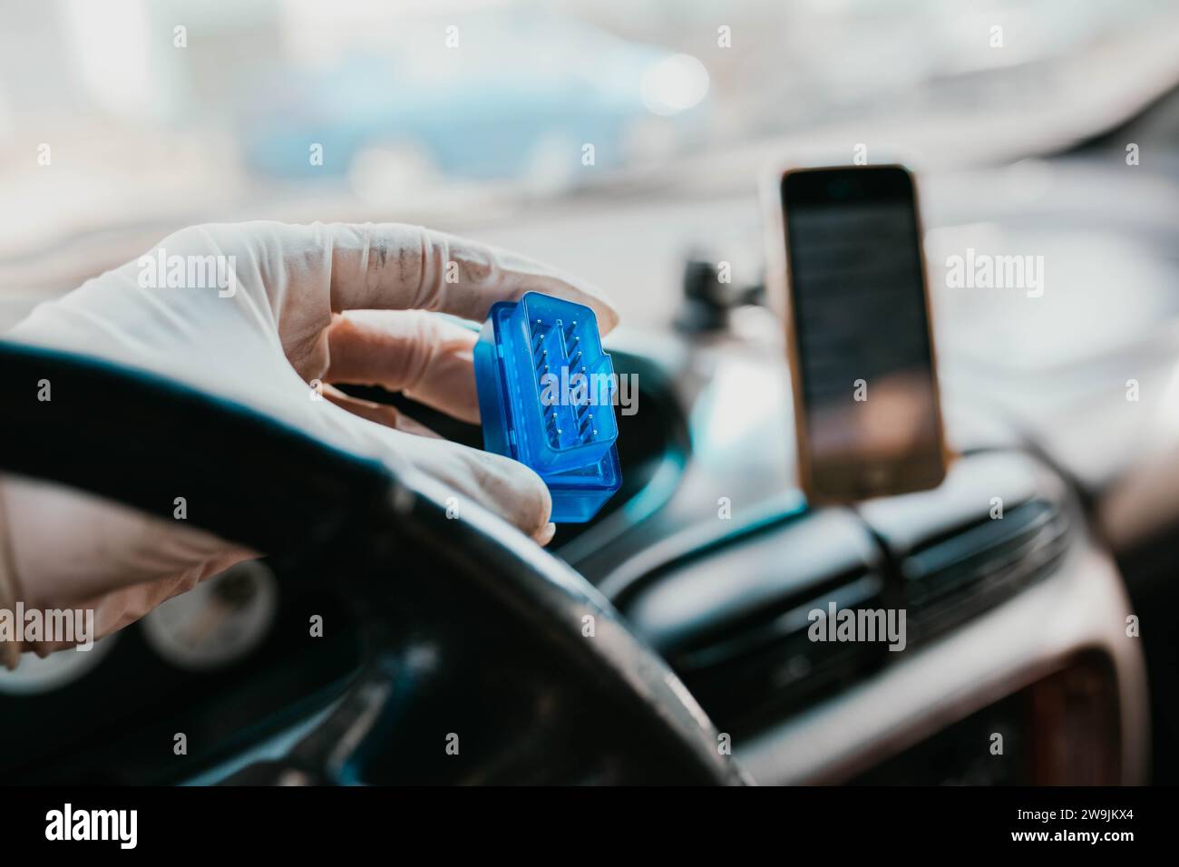 Car diagnostics using bluetooth scanner, car repair Stock Photo - Alamy