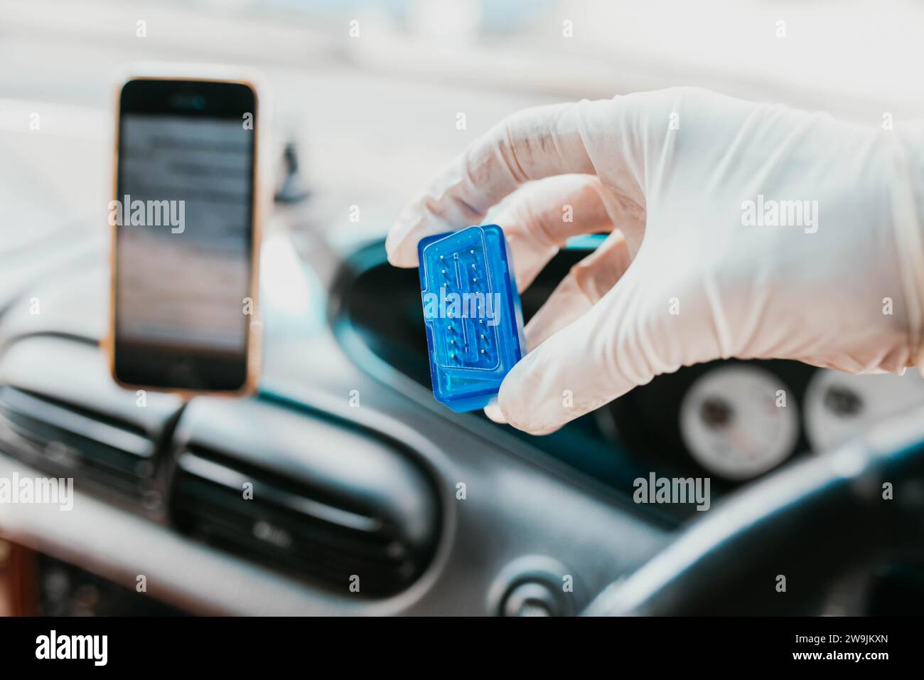 Car diagnostics using bluetooth scanner, car repair Stock Photo - Alamy