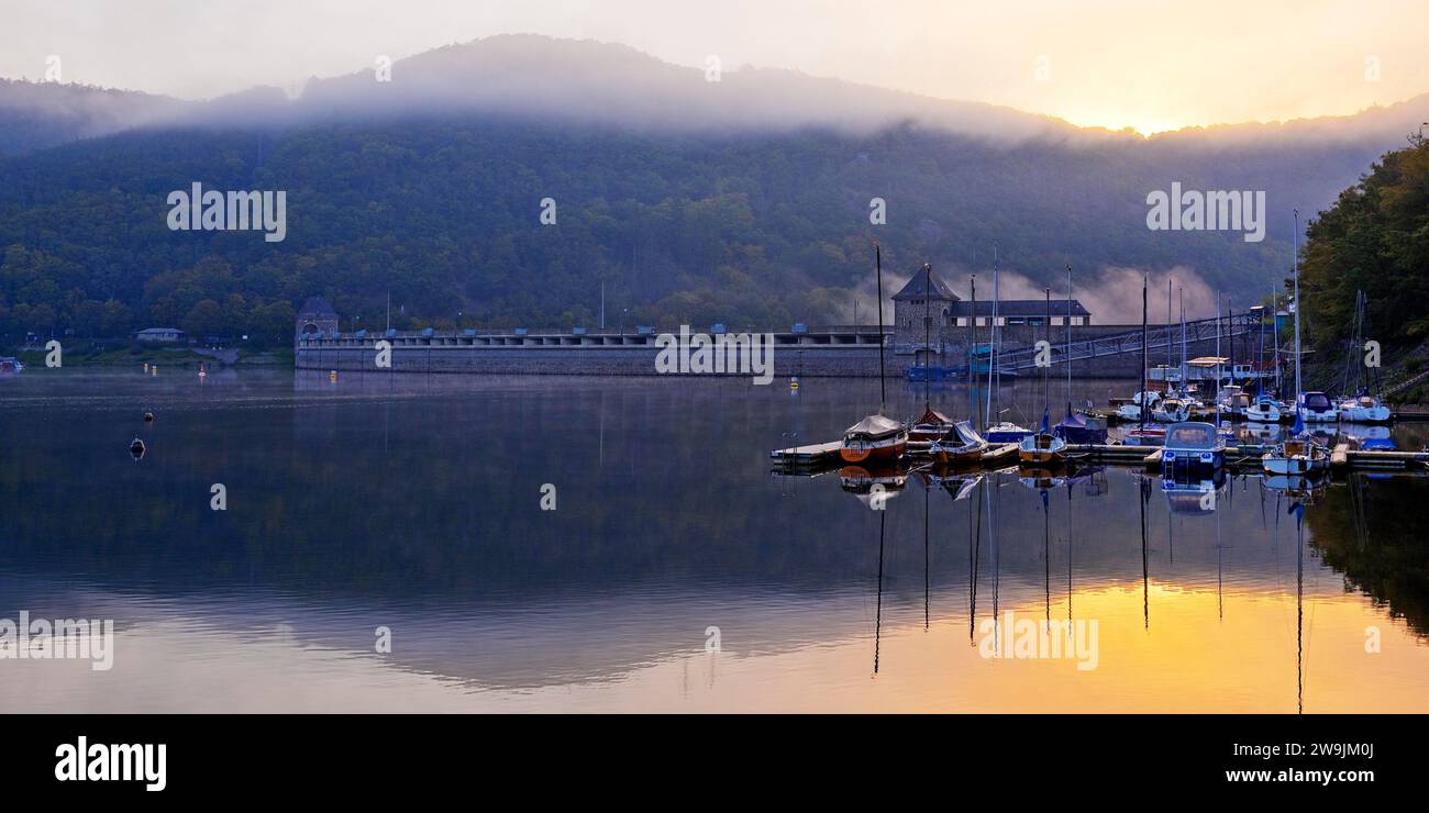 Eder dam with dam wall and pleasure boats on the Edersee in the early ...