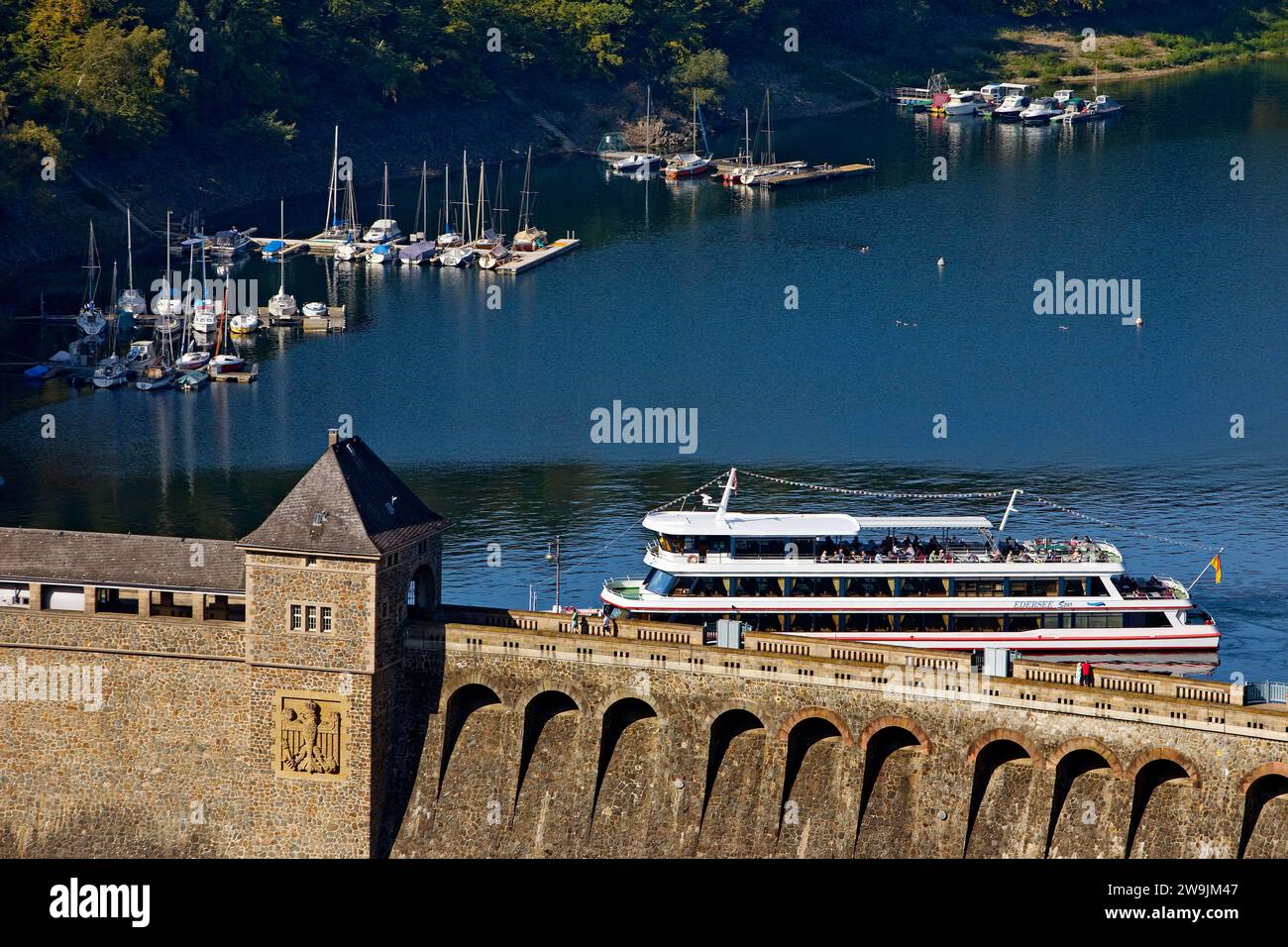 Elevated view of the Eder dam with the dam wall and the excursion boat ...