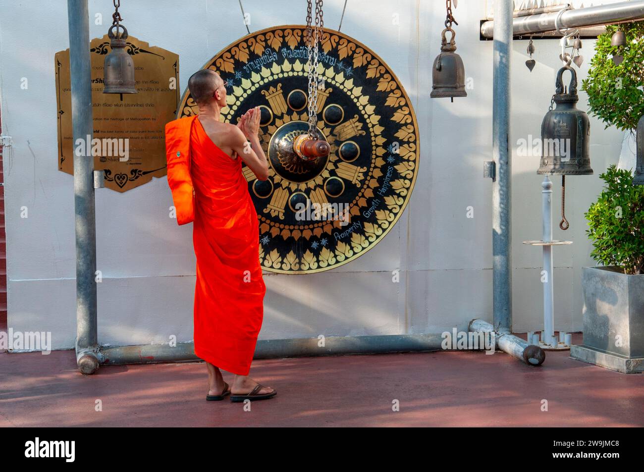 Monk in front of a ritual gong, Golden Mount, Bangkok, Thailand Stock ...