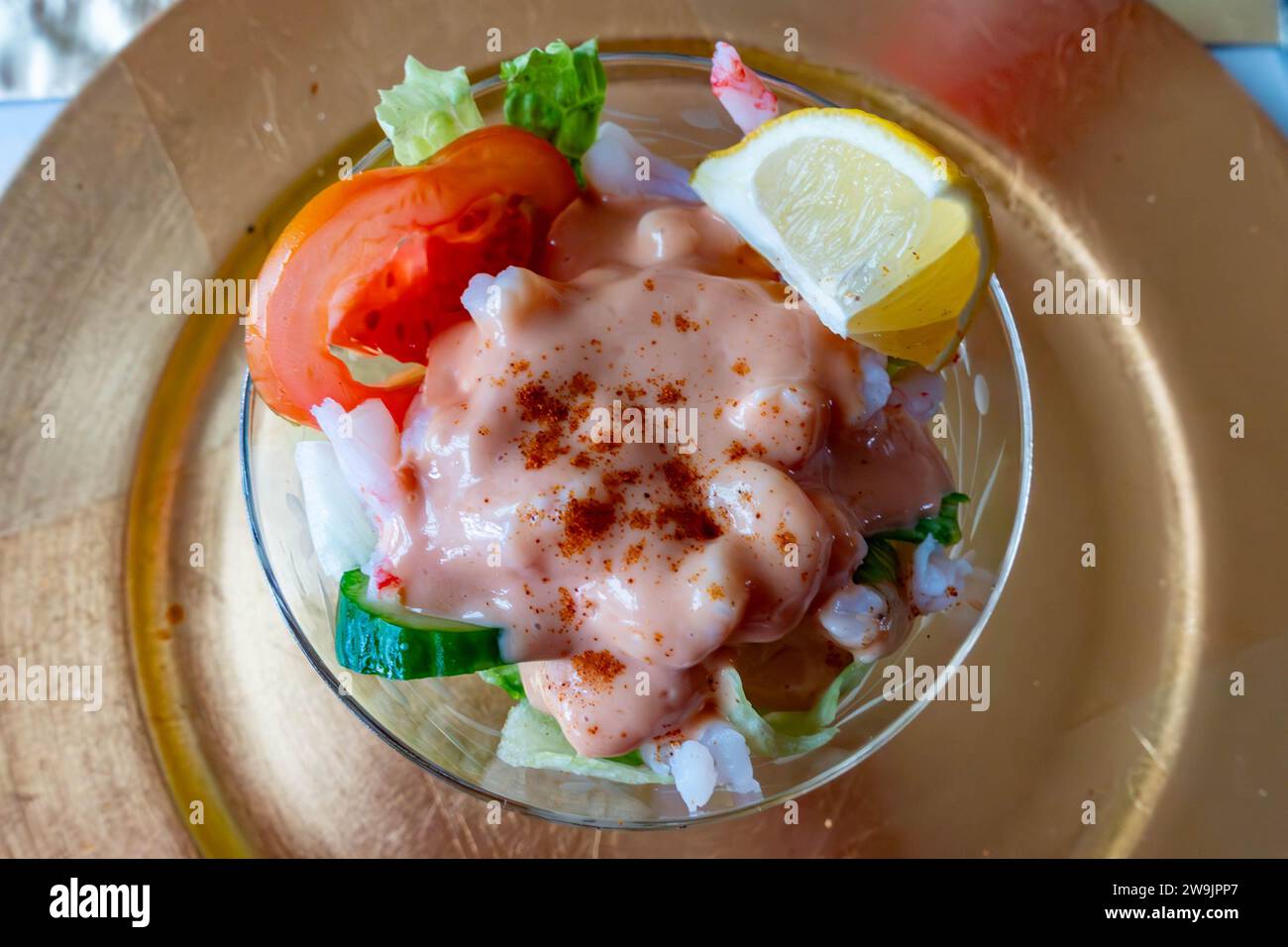Prawn cocktail server in a glass bowl as an appetiser, the first course ...