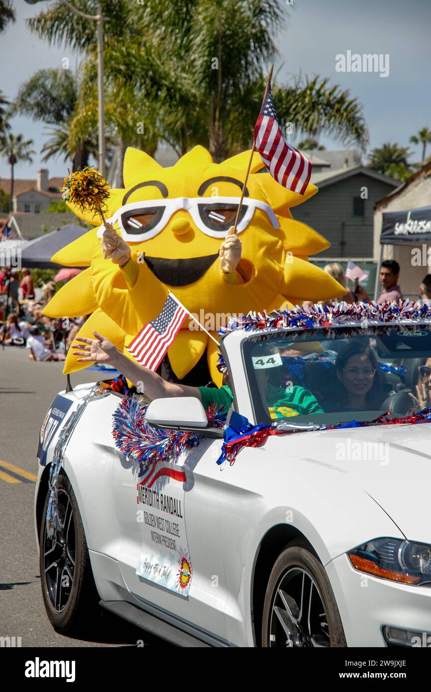 Dressed in a sunshine costume, a participant in a July Fourth parade in ...