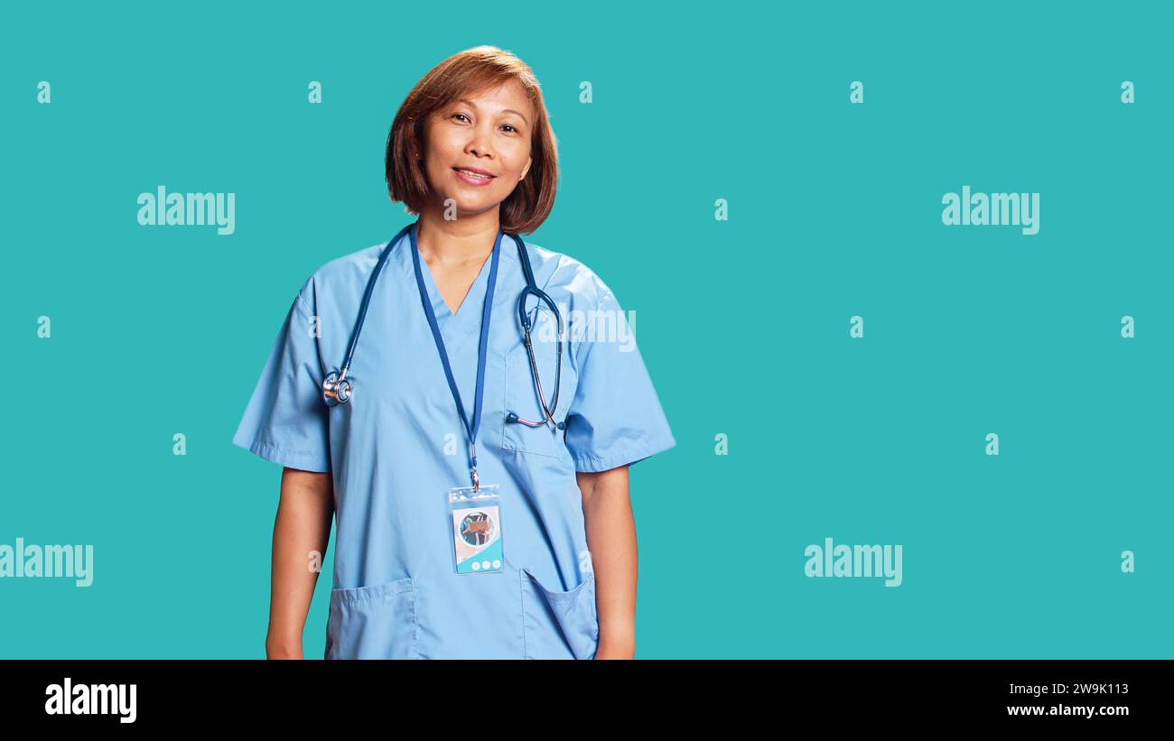 Happy proficient BIPOC nurse smiling while looking at camera. Portrait ...