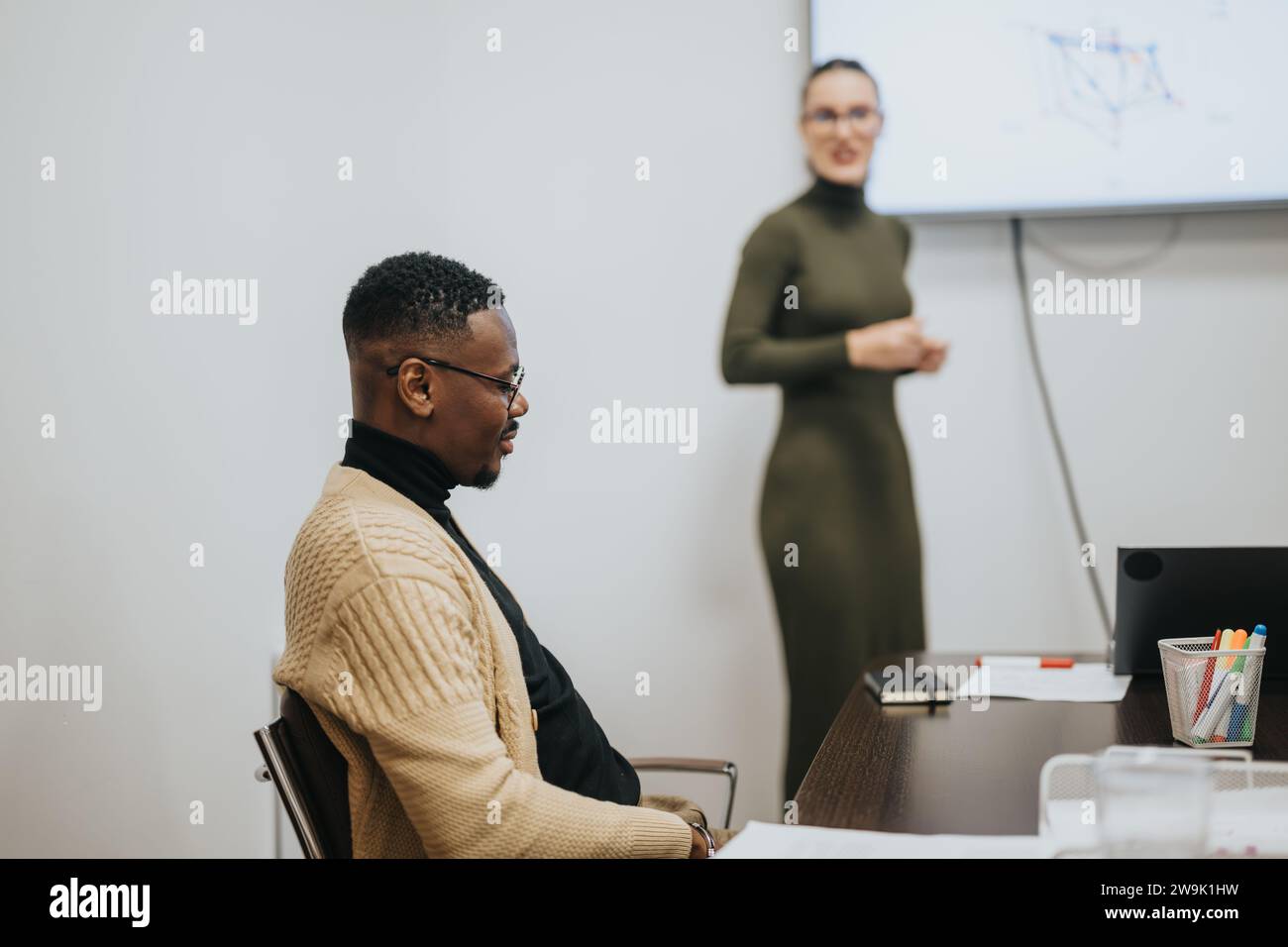 Successful cross-generational team collaborating and strategizing in a ...