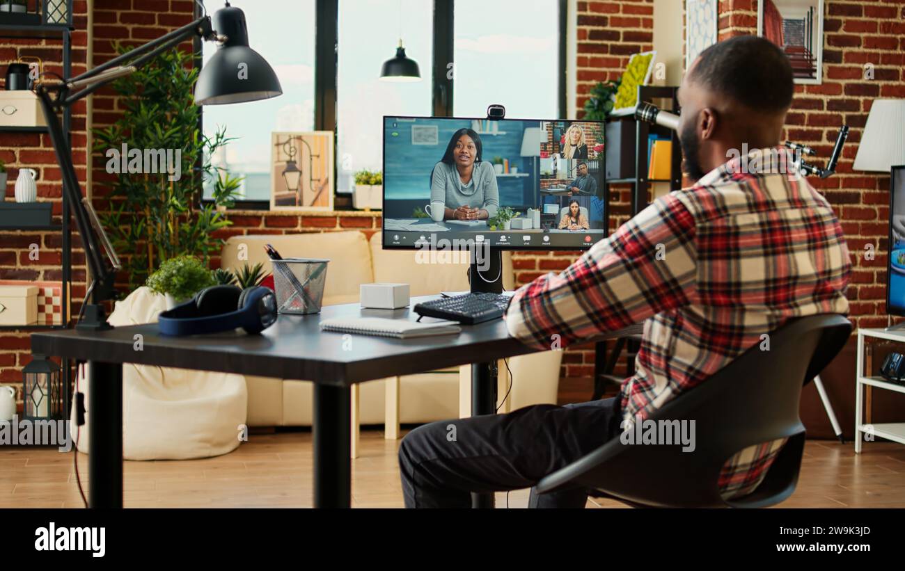 Smiling employee in video conference meeting greeting remote working ...