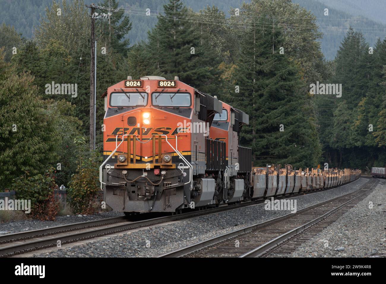 Skykomish, WA, USA - September 18, 2023; BNSF freight train waits at Skykomish with empty load ...