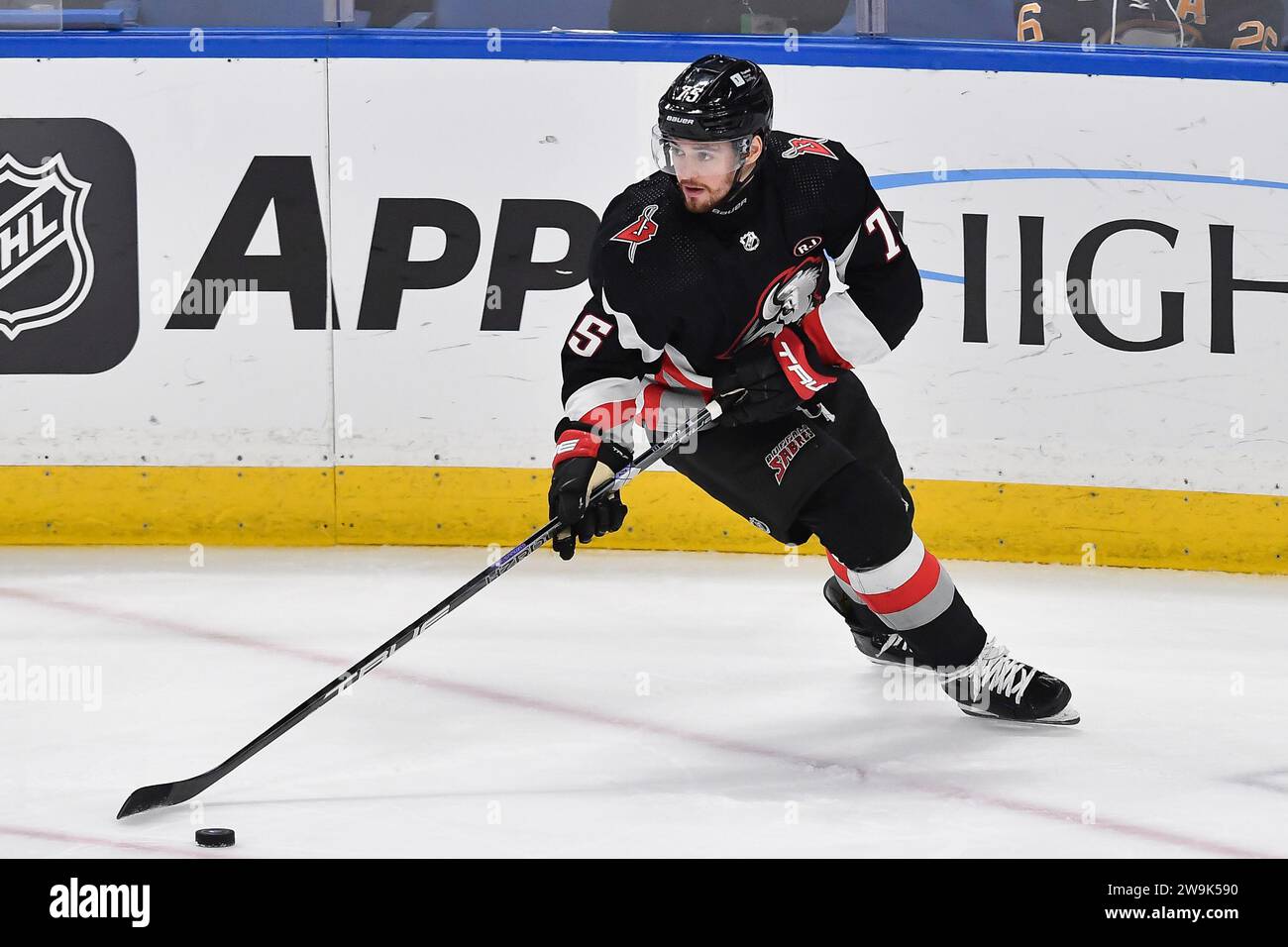 Buffalo Sabres defenseman Connor Clifton (75) skates with the puck ...