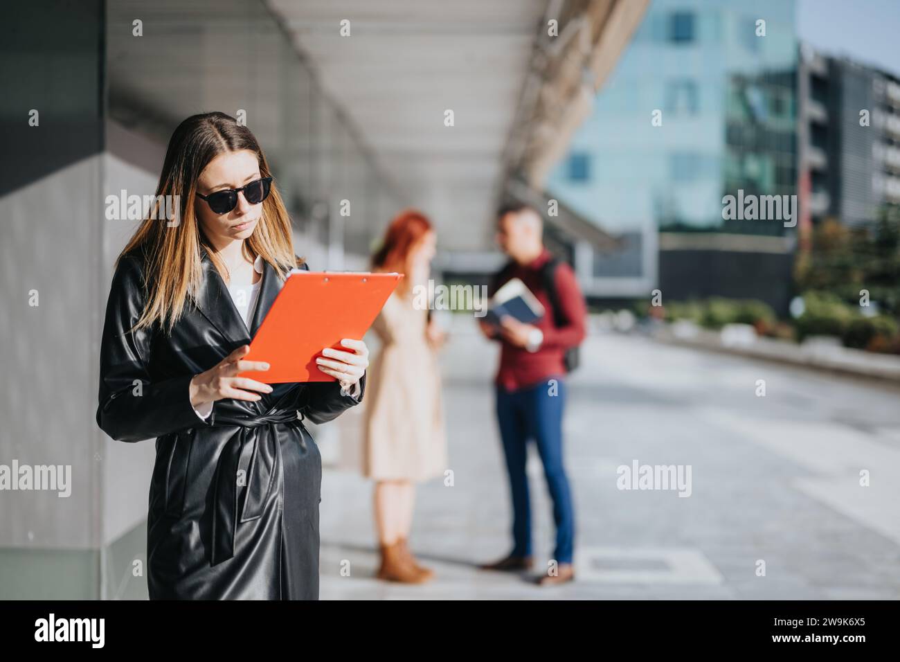 A team of young professionals brainstorming in an urban city ...