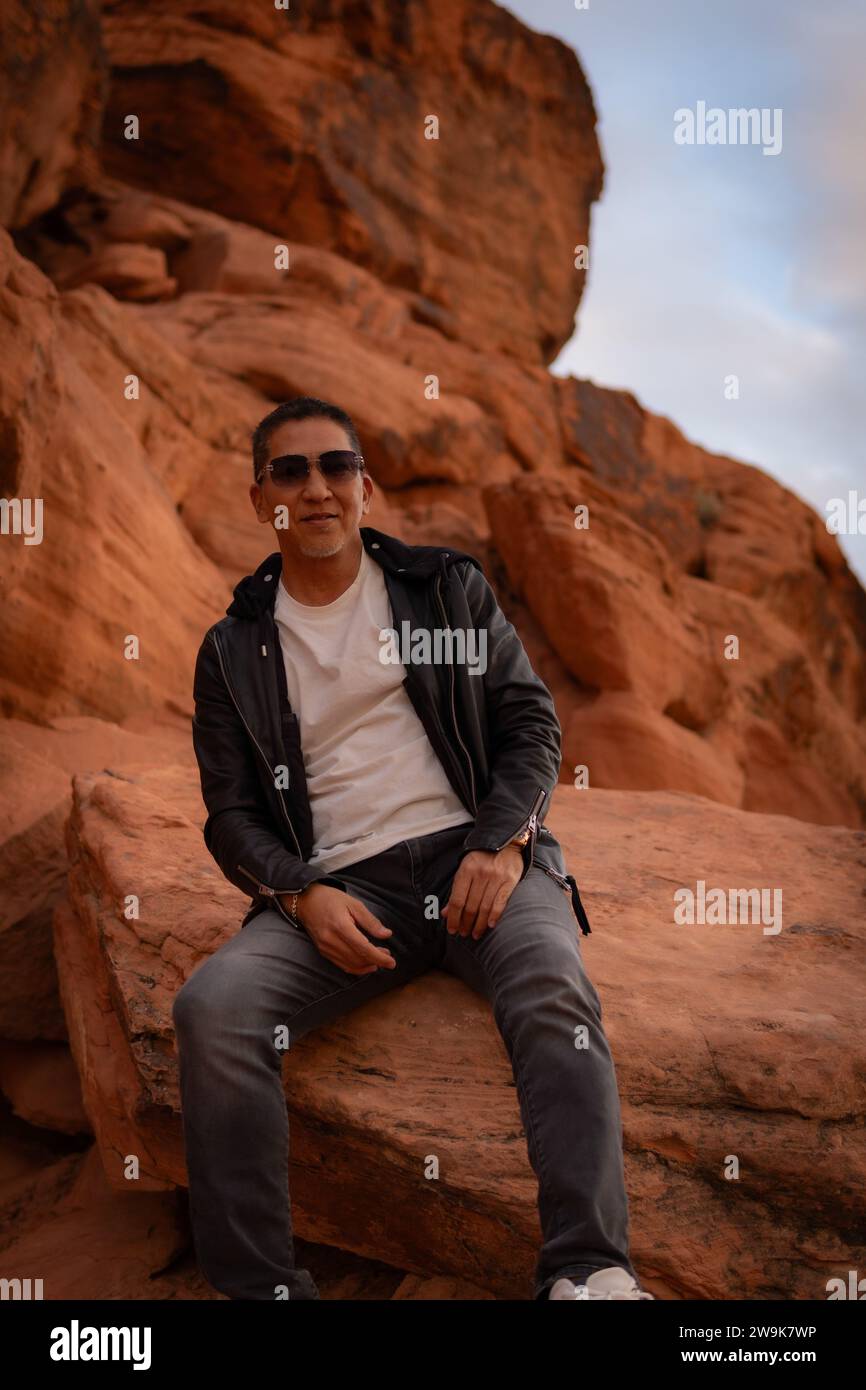 Male Model in the desert during the sunset Stock Photo - Alamy