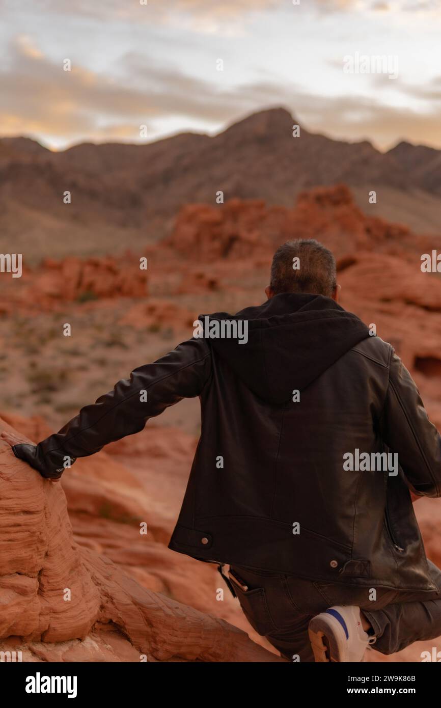 Male Model in the desert during the sunset Stock Photo - Alamy