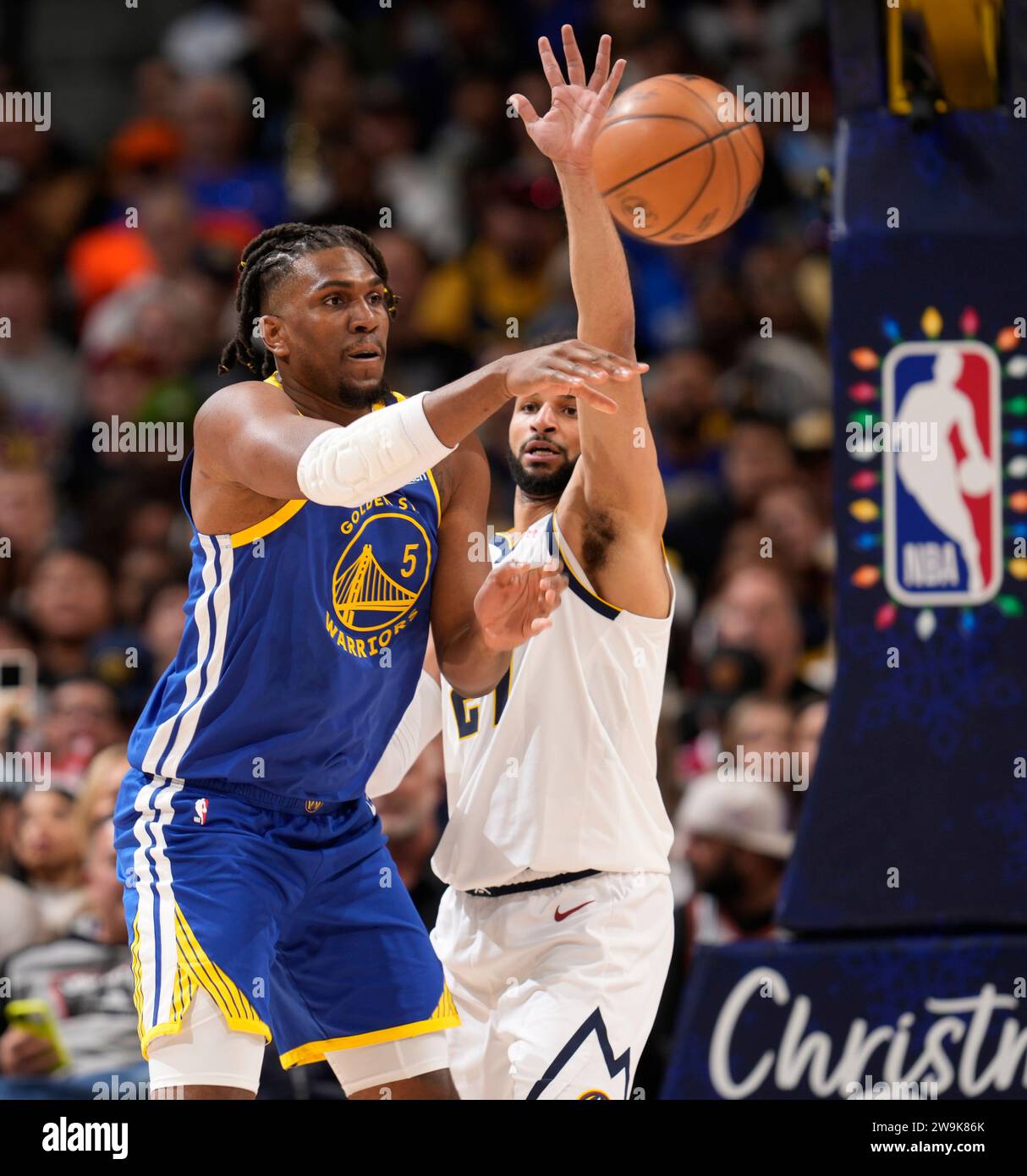 Golden State Warriors forward Kevon Looney (5) and Denver Nuggets guard ...
